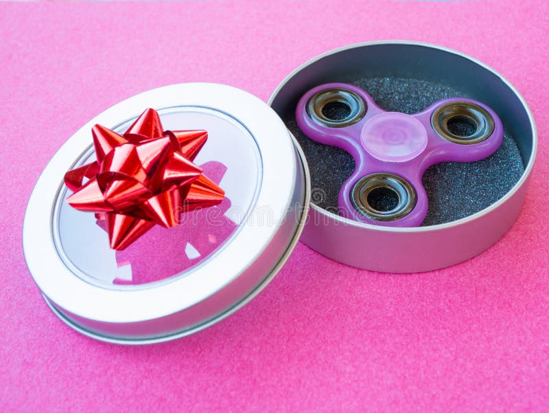 Popular Colourful Fidget Spinner Toy in a Gift Box on a Colored ...