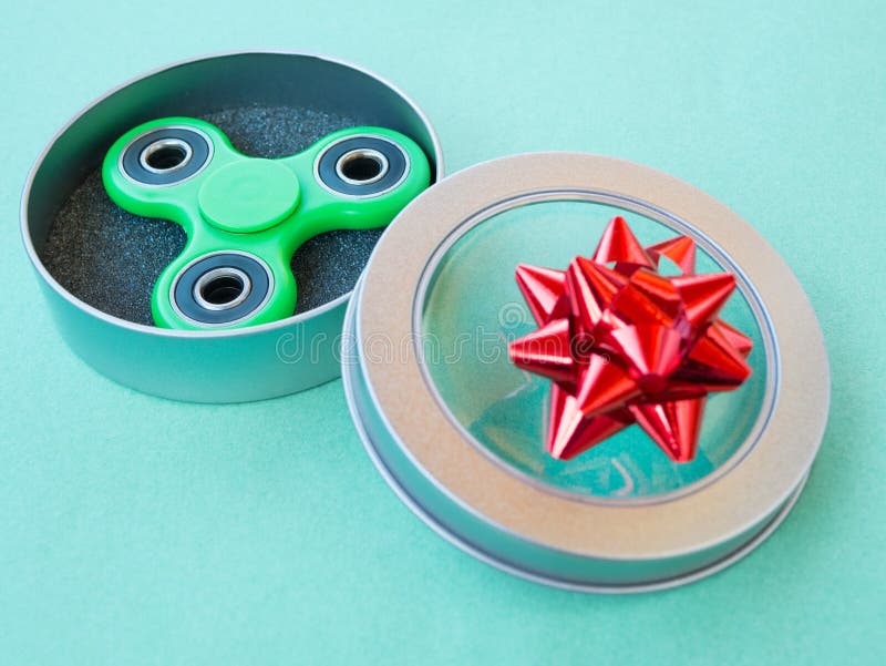 Popular Colourful Fidget Spinner Toy in a Gift Box on a Colored ...