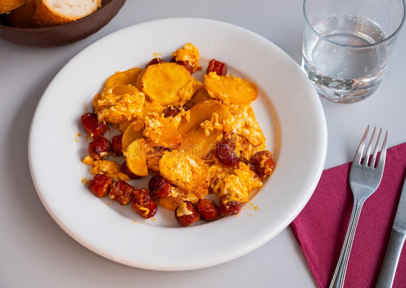 Popular Spanish Dish is Fried Eggs with Chistorra and Potatoes Stock ...