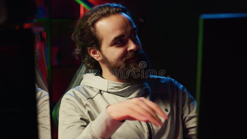 Popular Streamer in Neon Illuminated Studio Chatting with Audience ...