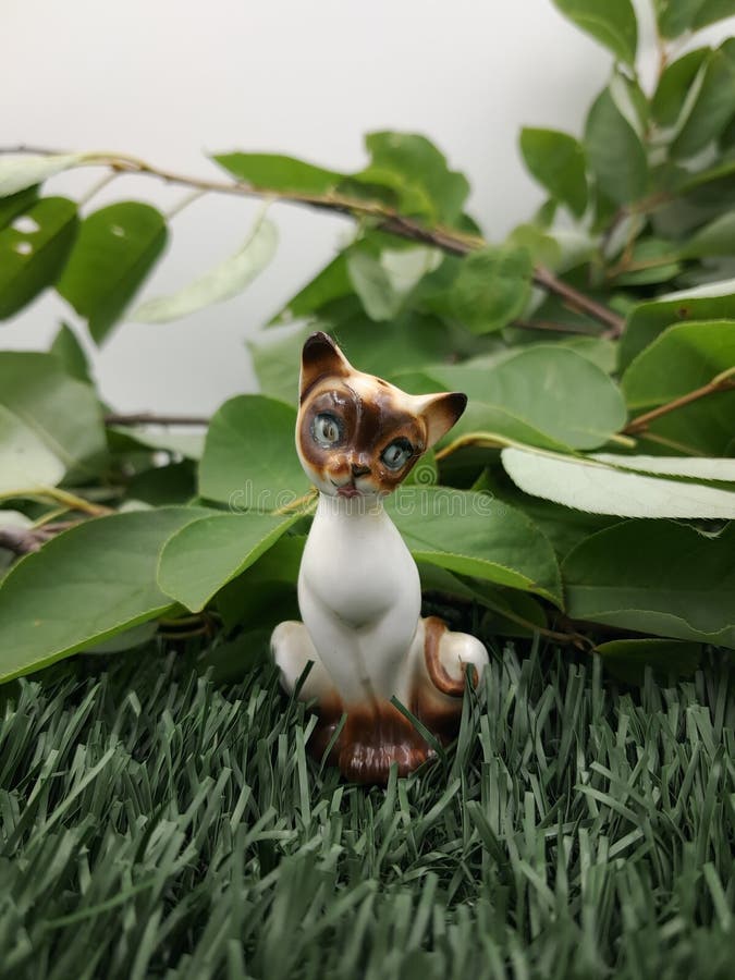 Porcelain cat figure stock image. Image of figurine - 326301171