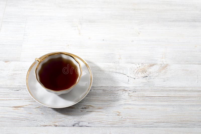 A Porcelain Cup with Tea on Long Empty Table. Space for Text Stock ...