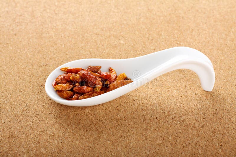 Porcelain Spoon with Red Chilli Stock Photo - Image of beans, paprika ...