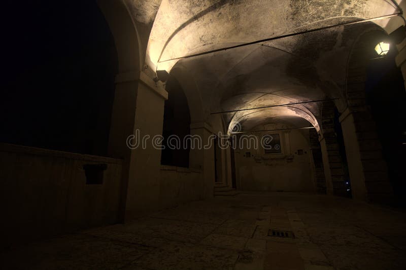 Porch Under a Buidling at Night with Street Light in it Stock Image ...