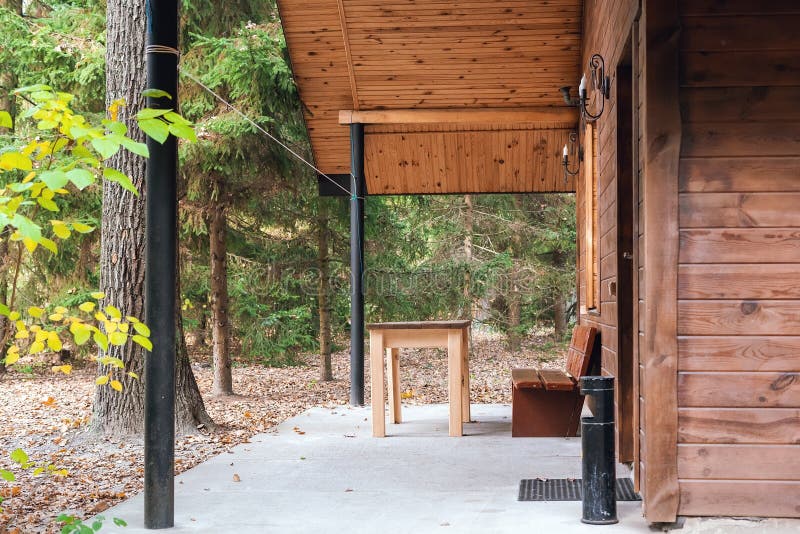Porch of a Wooden House among the Trees in the Autumn Forest Stock ...