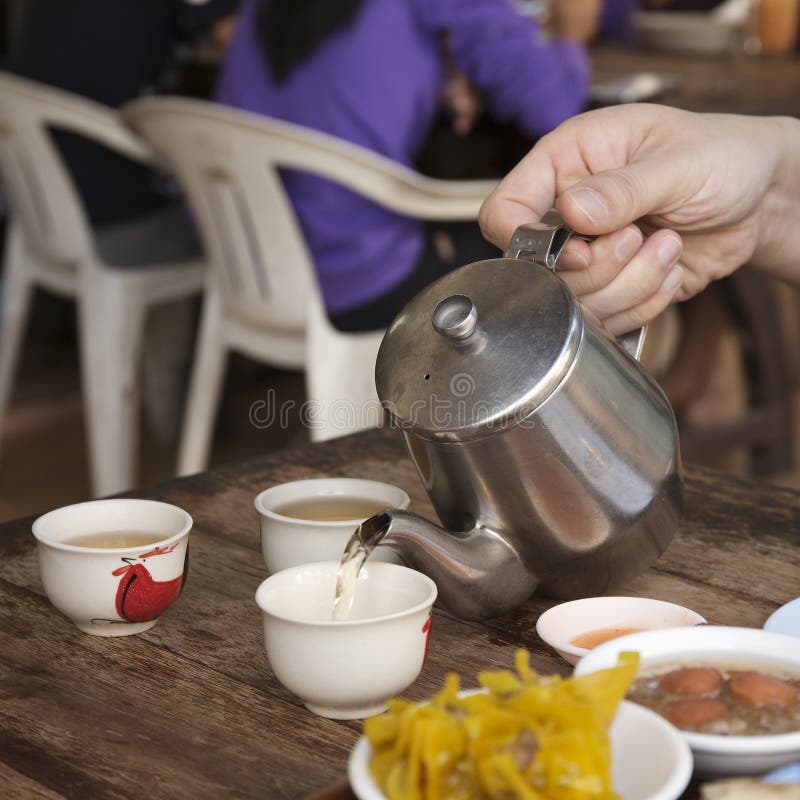 Poring Tea stock image. Image of saucer, teapot, background - 56025327