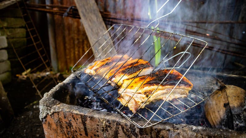 Pork Being Grilled on a Traditional Grill Stock Photo - Image of cooked ...