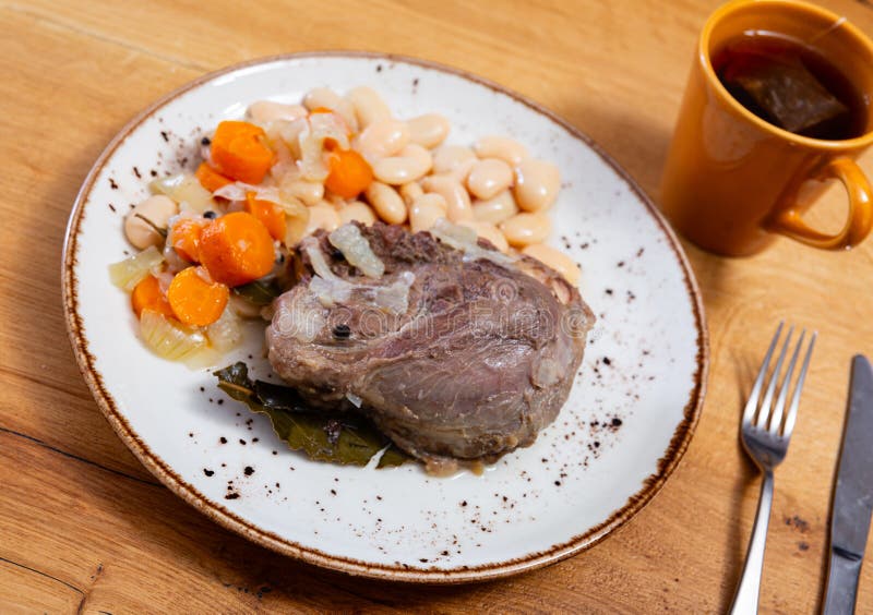 Pork Cheeks Served with Beans on Plate Stock Image - Image of slice ...