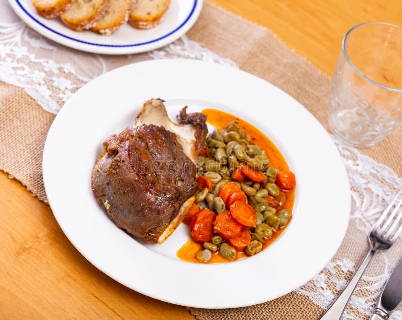 Pork Cheeks Served with Beans on Plate Stock Photo - Image of culinary ...