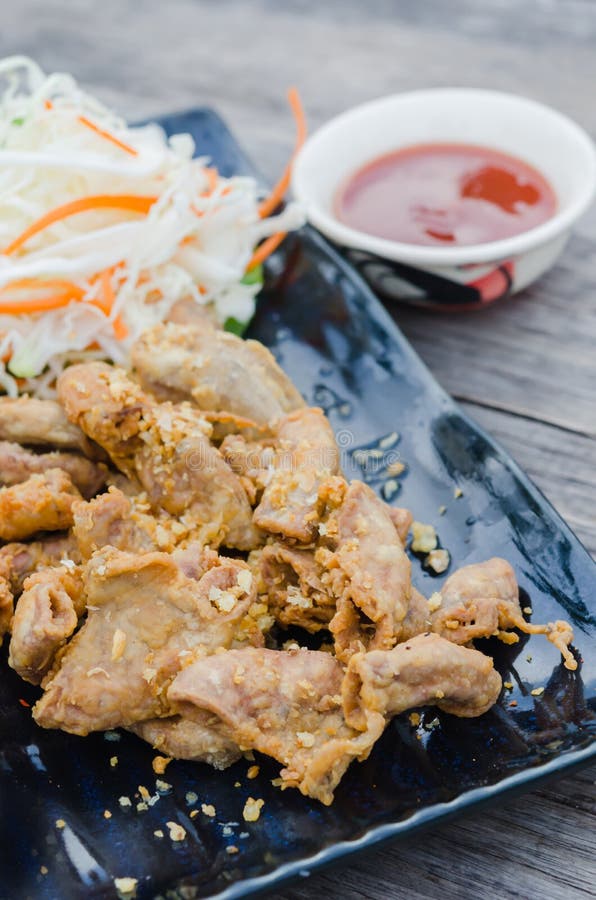 Pork chitterlings fried stock photo. Image of sauce, brown - 73471832