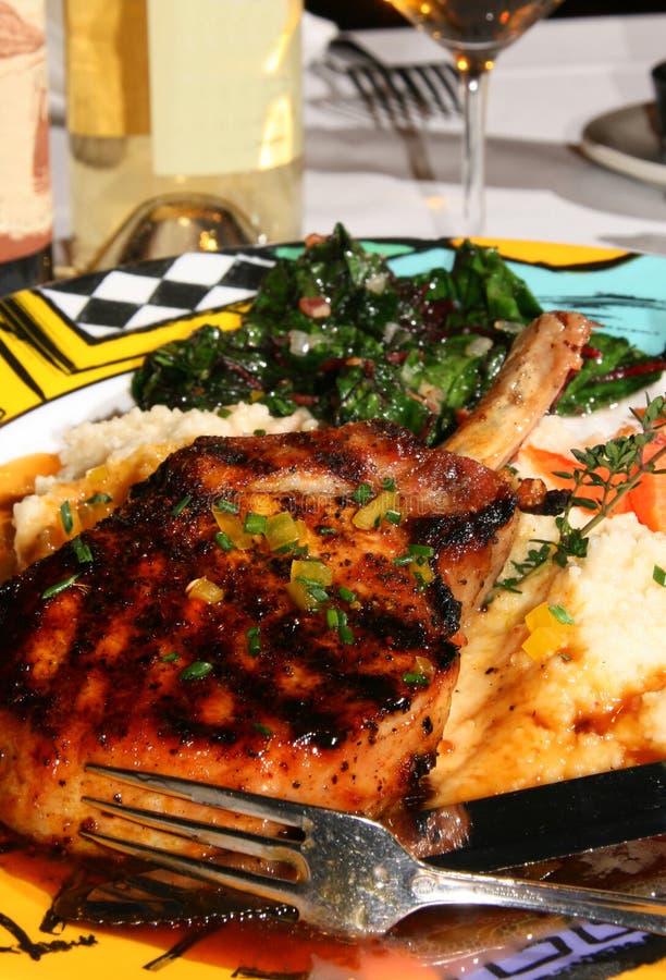 Pork chop main meal stock photo. Image of knife, food - 12256782