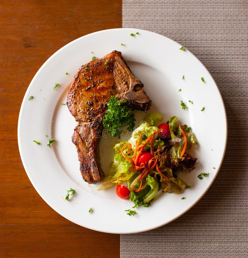 Pork Chop with Salad on Table Top View Stock Photo - Image of steak ...