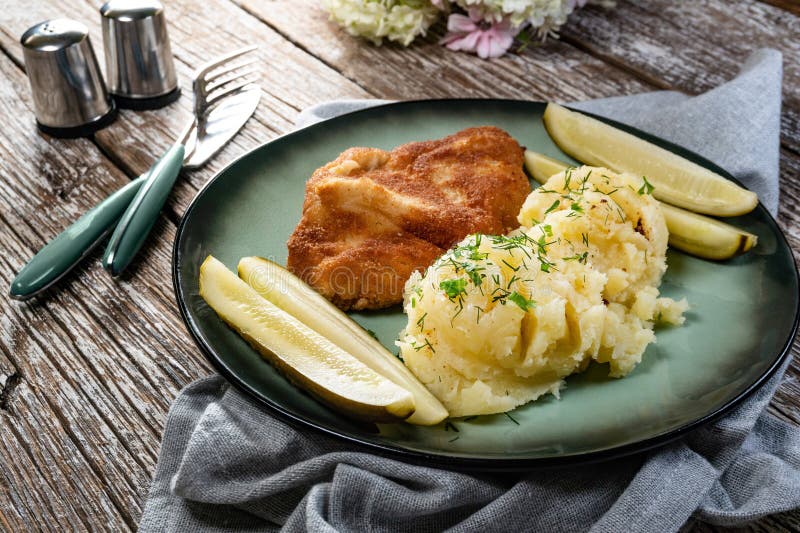 Pork Chop Served with Mashed Potatoes and Pickled Cucumber Stock Image ...