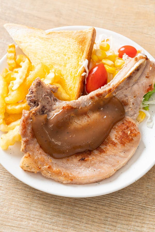 Pork Chop Steak with Chips and Mini Salad Stock Photo - Image of plate ...