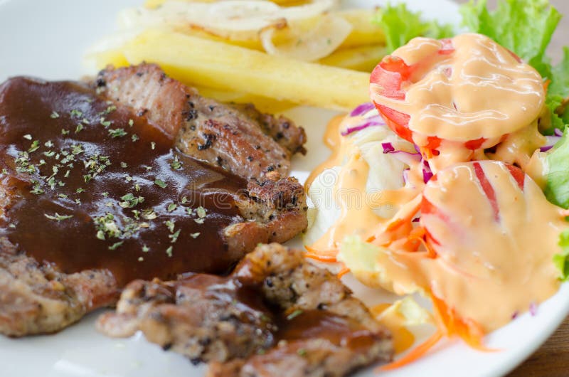 Pork chop steak stock image. Image of chips, leaf, fried - 40083219