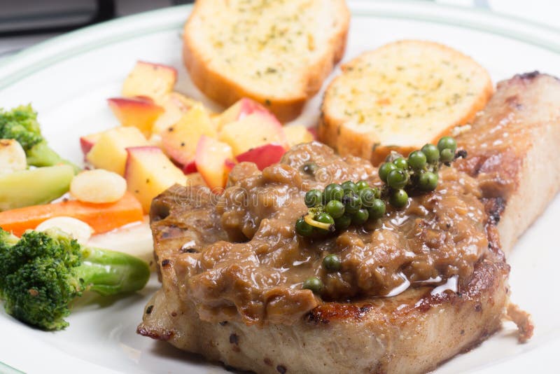 Pork chop steak stock photo. Image of parsnip, pepper - 74235224