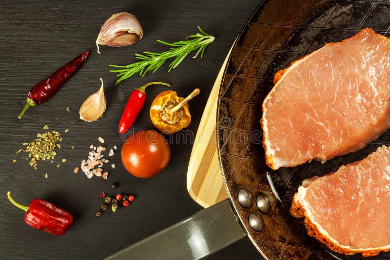 Pork Chop on a Steel Kitchen Pan. Fried Steak. Kitchen Utensils. Stock ...