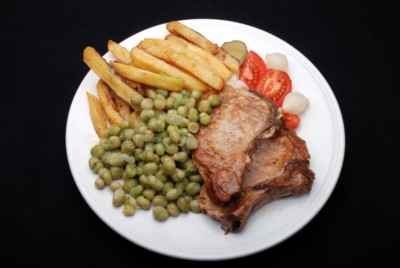 Pork chops chips and peas stock photo. Image of cooking - 11464052
