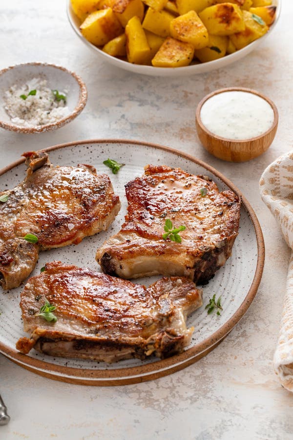 Pork Chops Grilled or Seared on a Serving Plate Stock Image - Image of ...