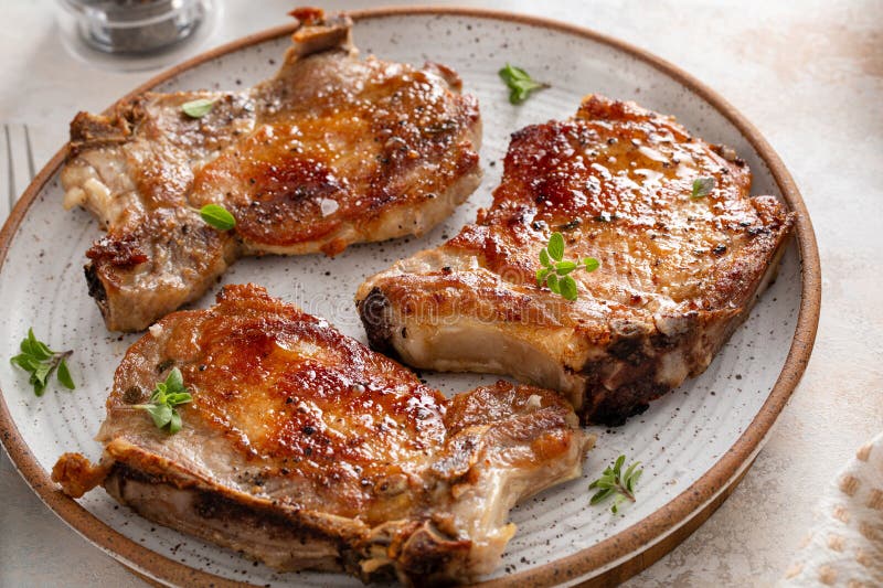 Pork Chops Grilled or Seared on a Serving Plate Stock Image - Image of ...