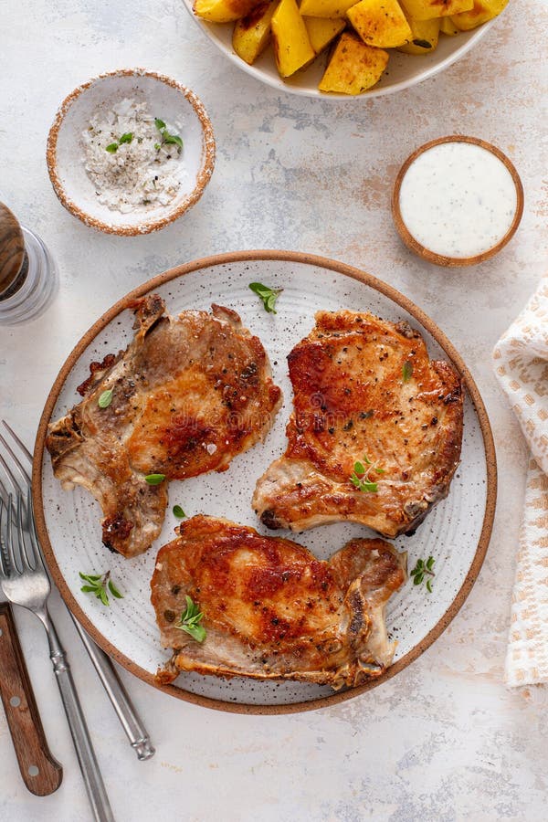 Pork Chops Grilled or Seared on a Serving Plate Stock Image - Image of ...