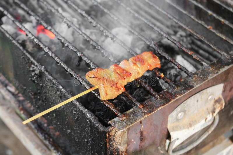 Pork Cook on the Bar-b-que Grill in Thai Style with Fire Smoke Stock ...