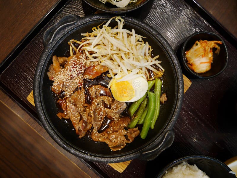 Pork Teppanyaki with Egg and Vegetables in Hot Plate Stock Image ...