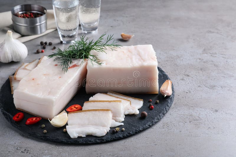 Pork Fatback with Spices Served on Grey Table. Space for Text Stock ...