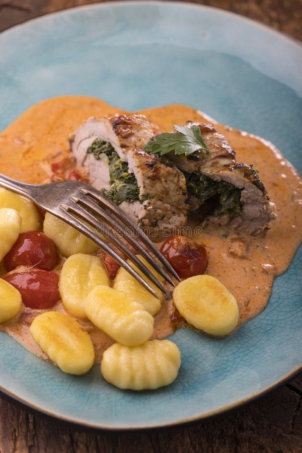 Pork fillet with gnocchi stock photo. Image of cooked - 239929474