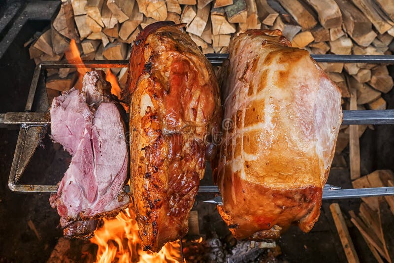 Pork Ham Roasted on an Open Fire Stock Photo - Image of burning ...