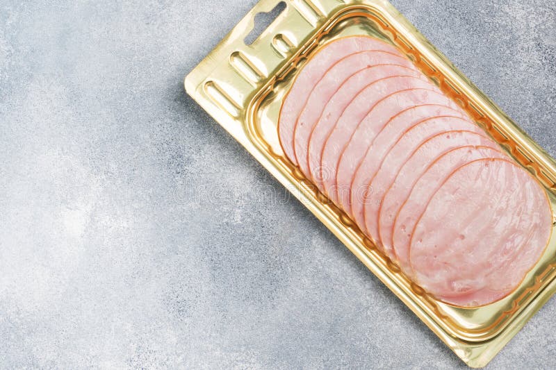Pork Ham in Thin Slices in a Vacuum Package on the Table. Meat Sliced ...