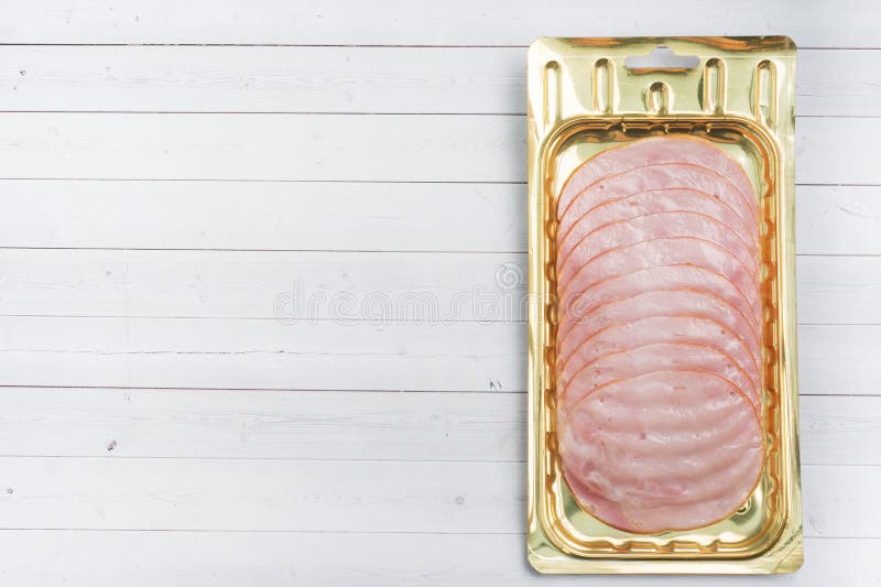 Pork Ham in Thin Slices in a Vacuum Package on the Table. Meat Sliced ...