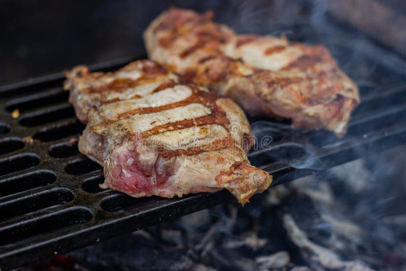 Pork Meat is Cooked on a Barbecue Grill. Half Cooked Stock Image ...