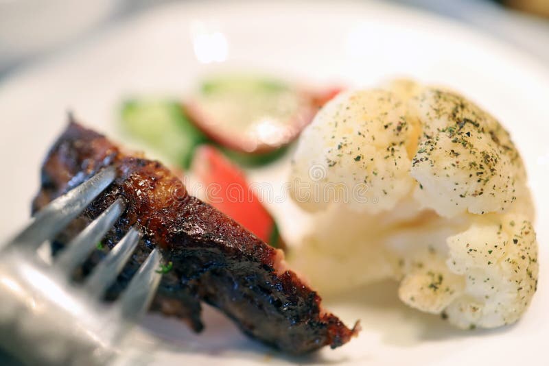 Pork Rib on a Fork Close-up Stock Photo - Image of spice, grilled ...