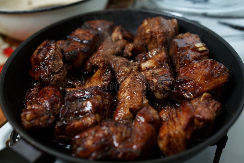 Pork ribs fried in a pan. stock photo. Image of barbecue - 108067270
