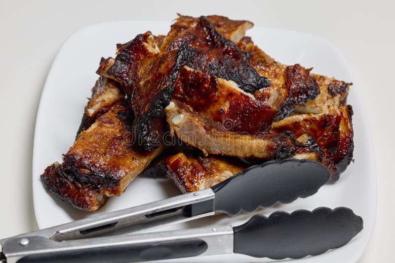Pork ribs on a plate stock image. Image of restaurant - 307374463
