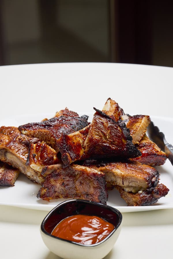 Pork ribs on a plate stock photo. Image of sauce, pork - 307374476