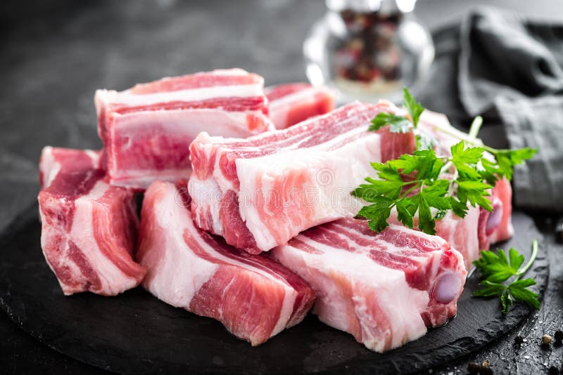 Pork ribs, raw meat stock image. Image of bone, slate - 103845429