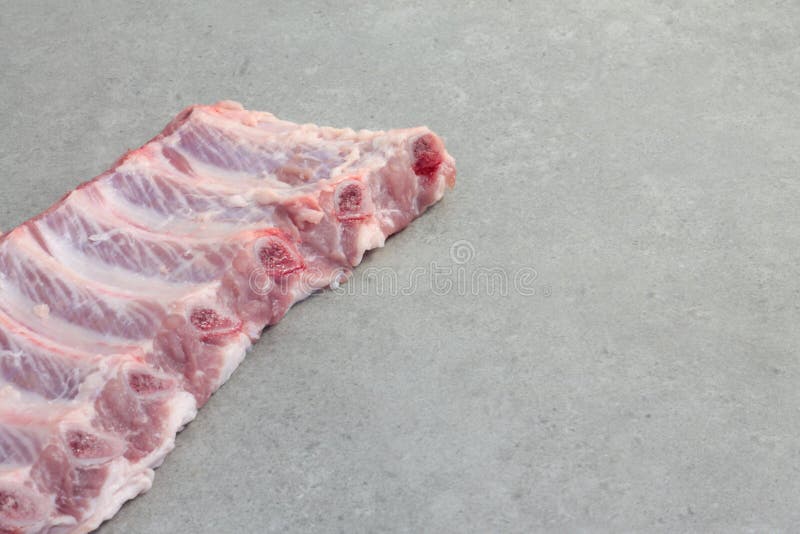 Pork Ribs with Red Raw Meat Lie on a Gray Background Stock Image ...