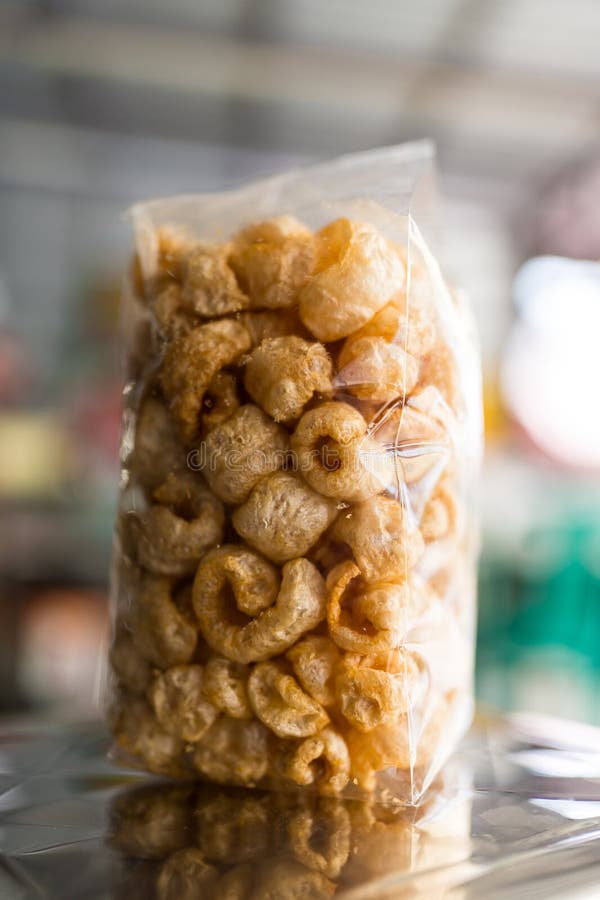 Pork Rind or Pork Scratching without Fat Caps in a Plastic Bag Stock ...