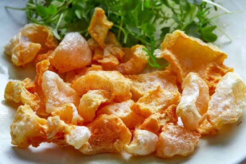 Pork Rinds Appetizer on White Dish Stock Photo - Image of food, crunchy ...