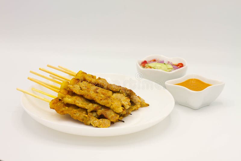 Pork satay in white plate stock image. Image of leaf - 162013281
