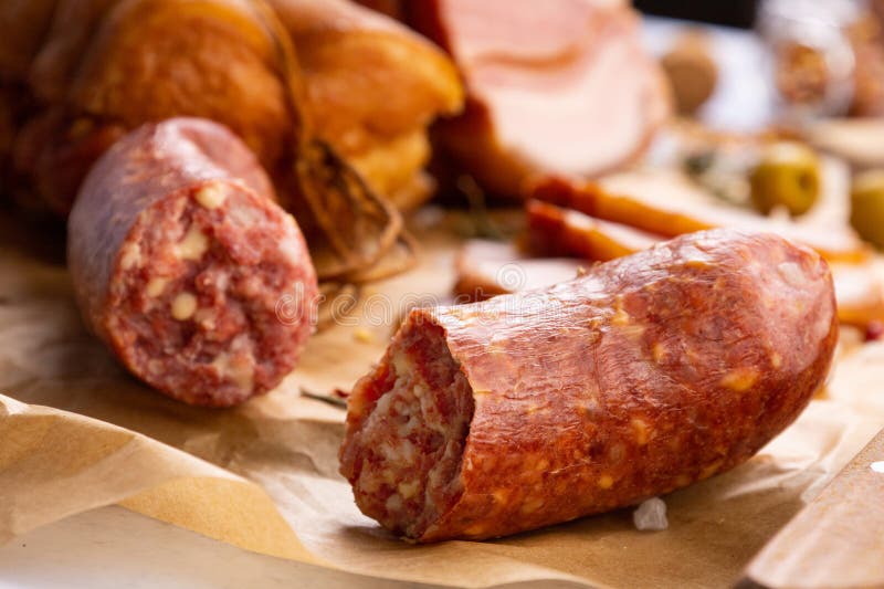 Pork Sausage with Cheese Broken in Half Lay on Parchment Stock Photo ...
