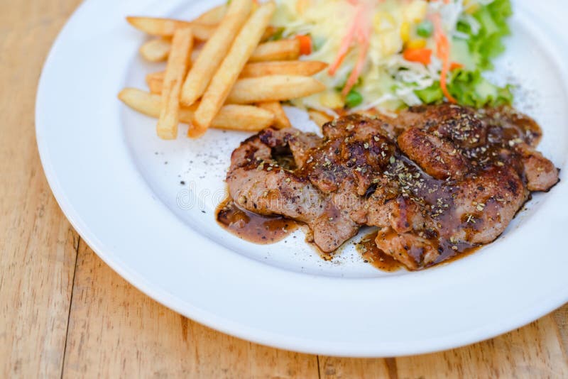 Pork Steak in Plate on Table Stock Image - Image of table, piece: 112546287