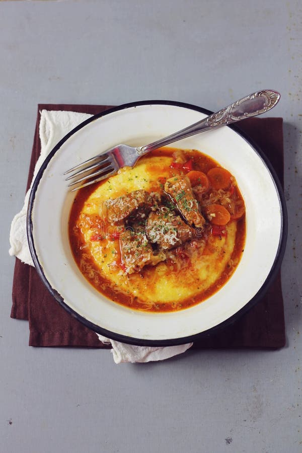 Pork stew with polenta stock image. Image of polenta - 65734883