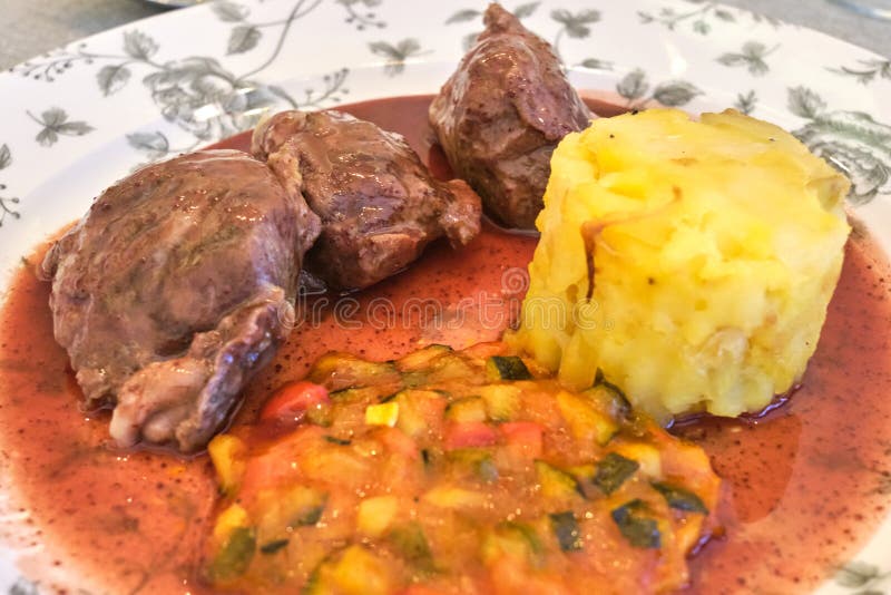 Pork with Vegetable Garnish and Potato Dice Stock Image - Image of ...