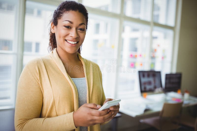 Porrait of Young Businesswoman Using Phone at Creative Office Stock ...