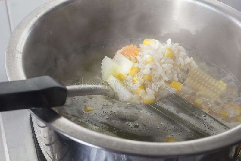 Porridge while Boiling in Stainless Pot Stock Photo - Image of spoon ...