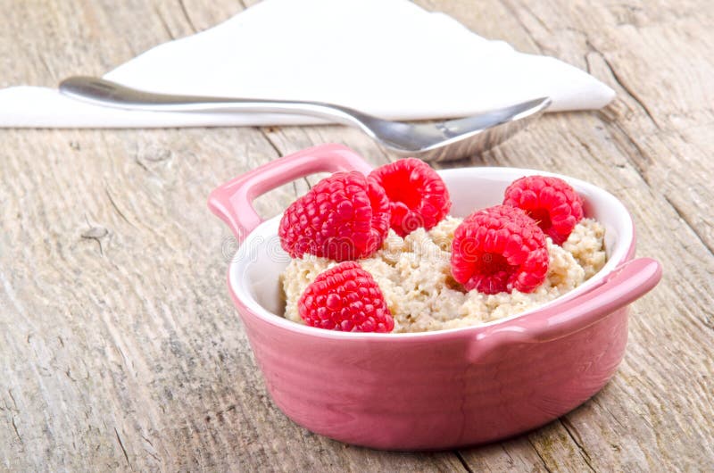 Porridge in a Bowl with Raspberry Stock Photo - Image of cooked ...