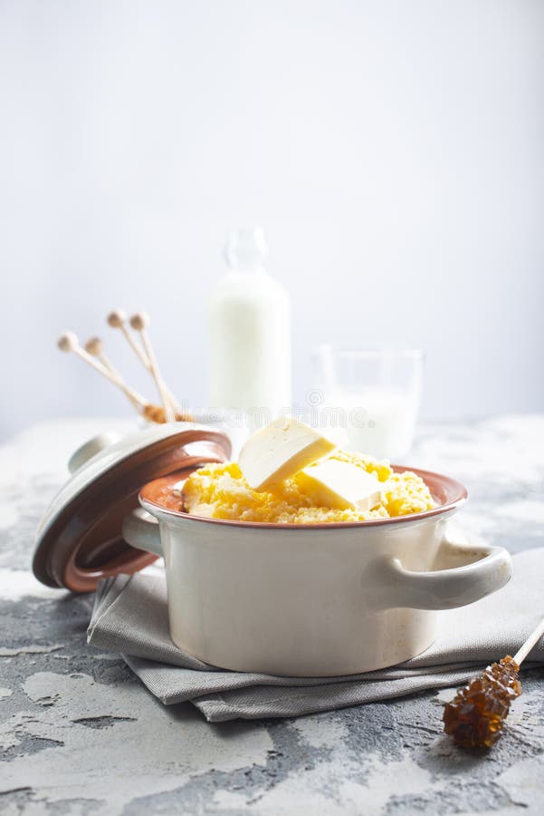 Porridge with Butter in Plate on Rustic Table Stock Image - Image of ...